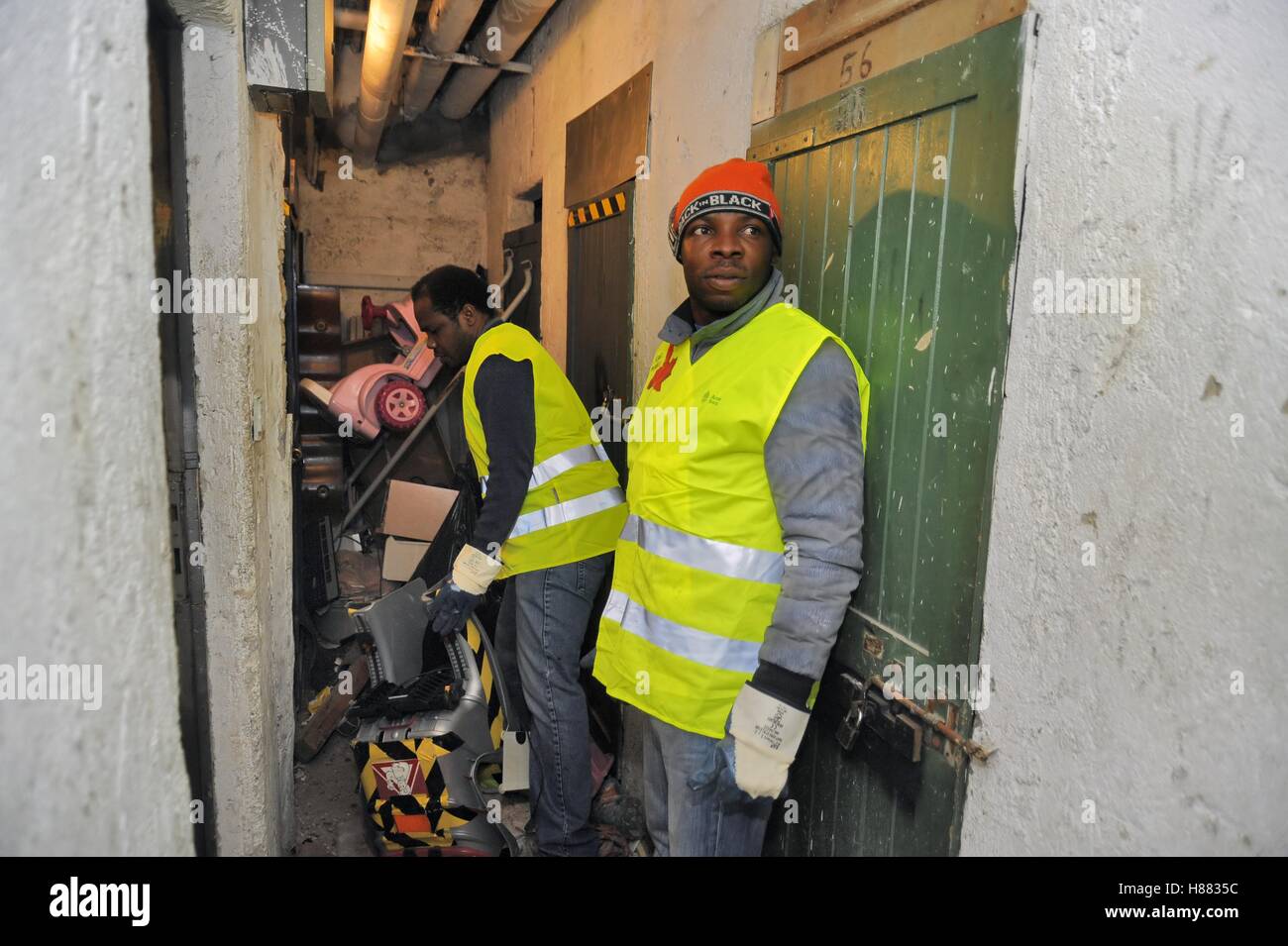 Milan, (Italy), a group of refugees and asylum seekers clean up ...
