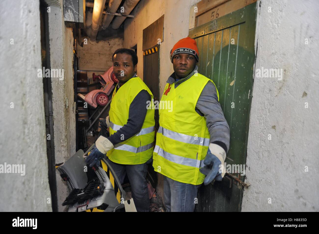 Milan, (Italy), a group of refugees and asylum seekers clean up ...
