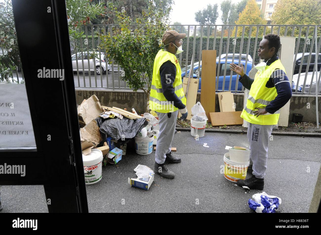 Milan, (Italy), a group of refugees and asylum seekers clean up ...