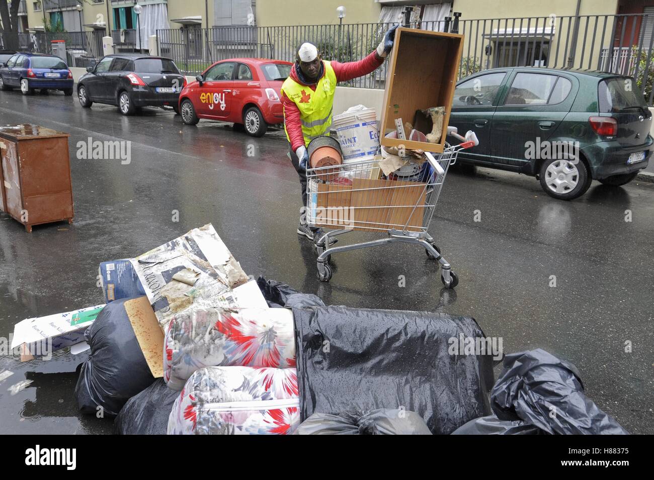 Milan, (Italy), a group of refugees and asylum seekers clean up ...