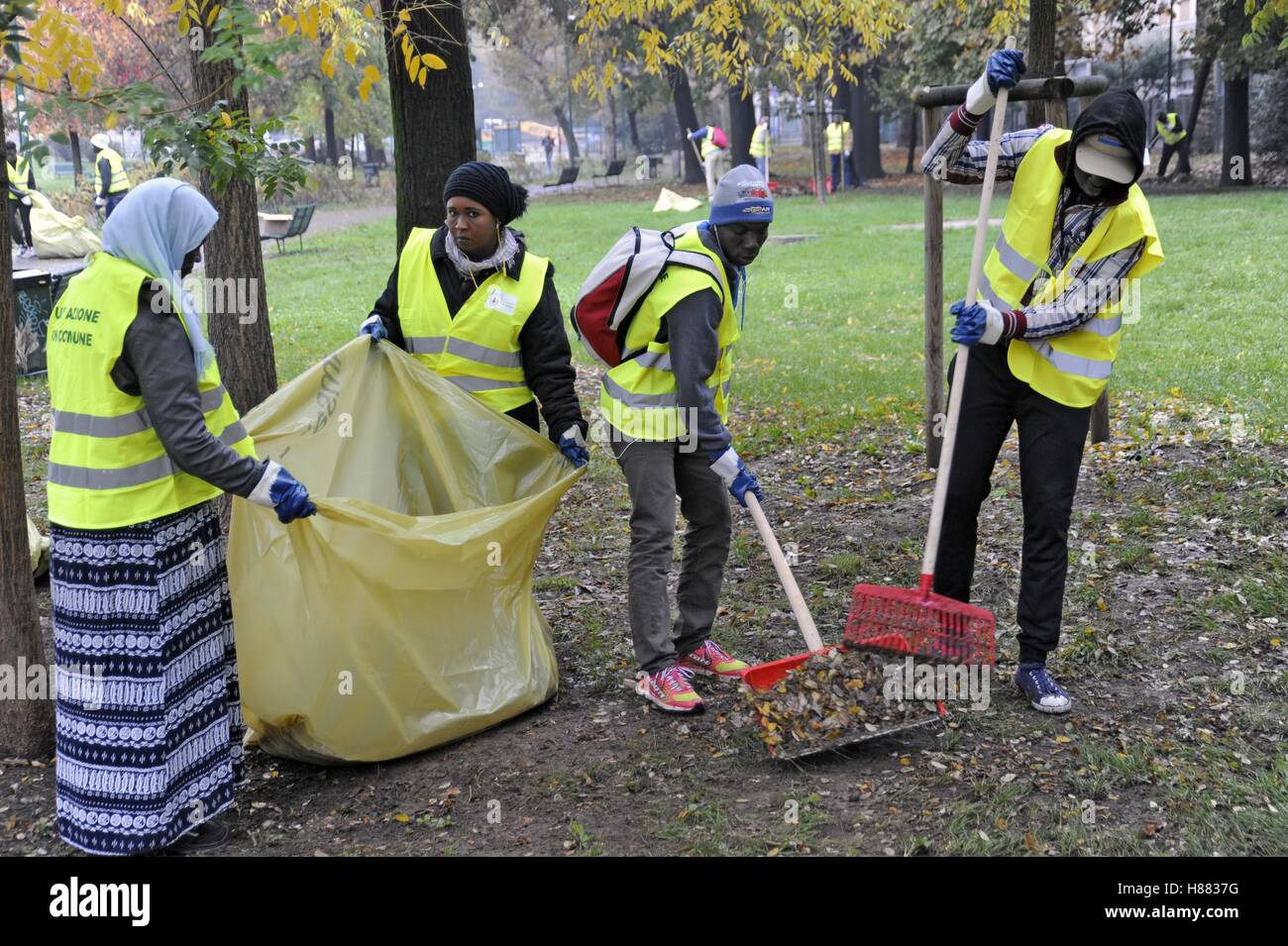 Milan, (Italy), a group of refugees and asylum seekers clean up dead ...