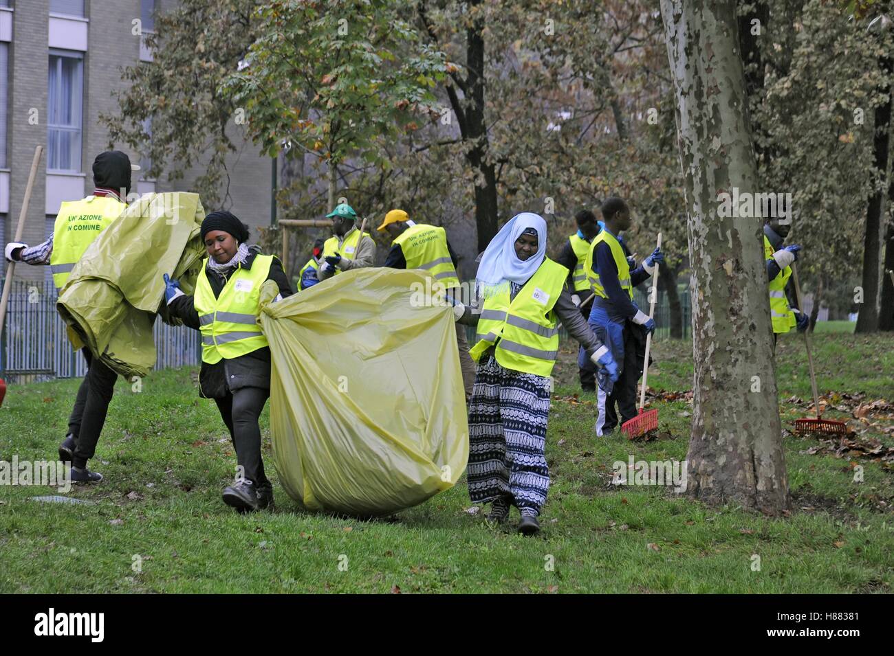 Milan, (Italy), a group of refugees and asylum seekers clean up dead ...