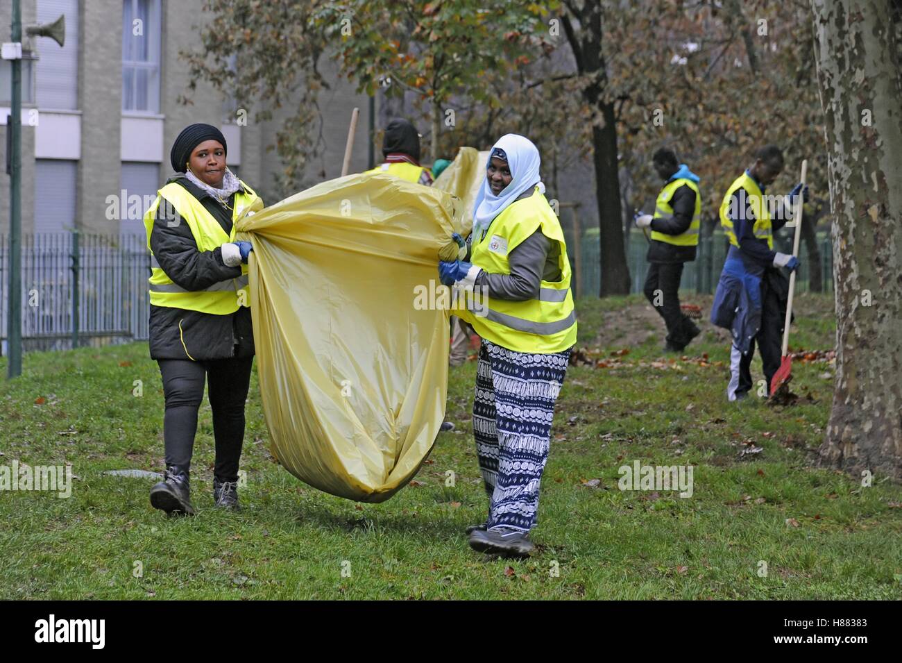 Milan, (Italy), a group of refugees and asylum seekers clean up dead ...