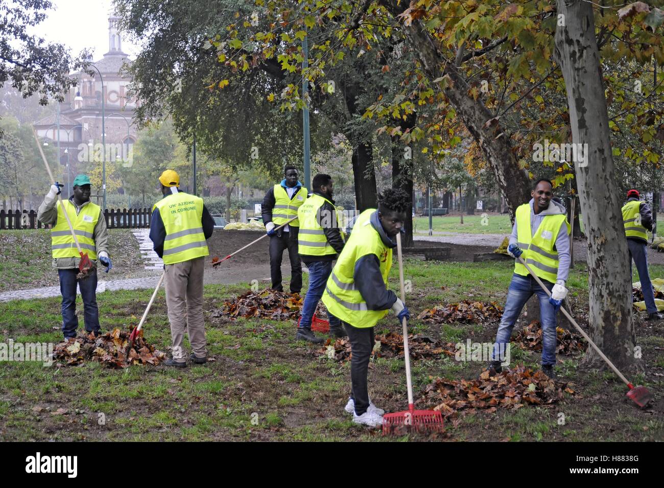 Milan, (Italy), a group of refugees and asylum seekers clean up dead ...