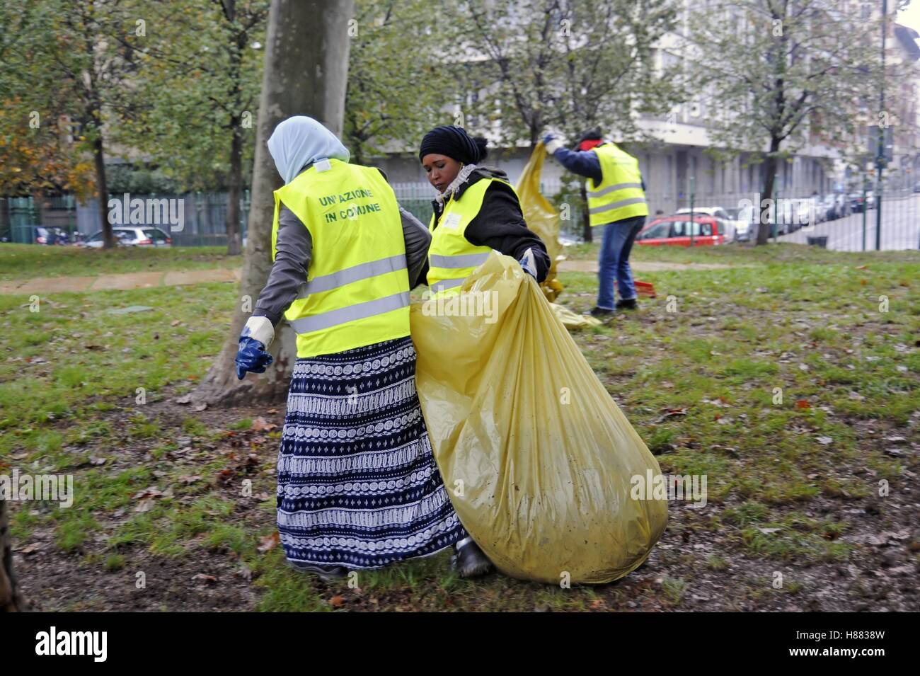 Milan, (Italy), a group of refugees and asylum seekers clean up dead ...