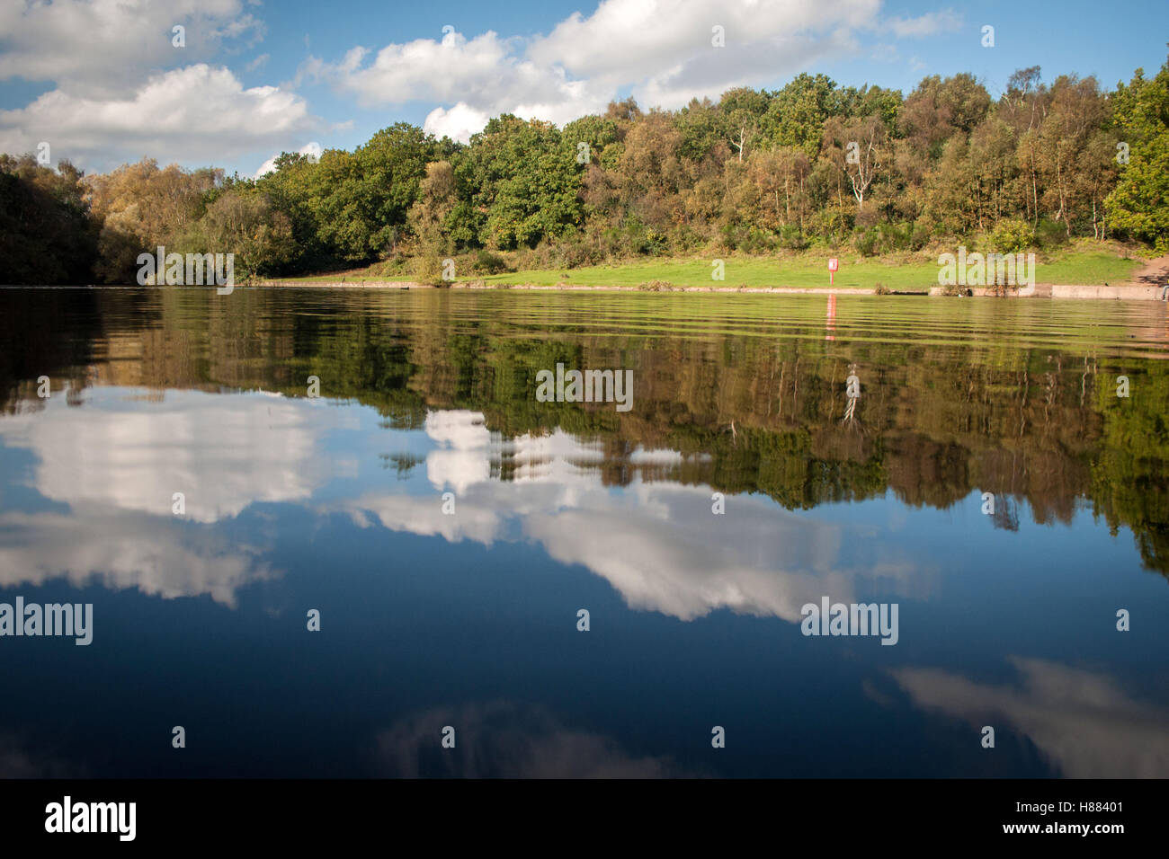 Autumn colours and clouds in Keepers Pool, Sutton Park, Sutton ...
