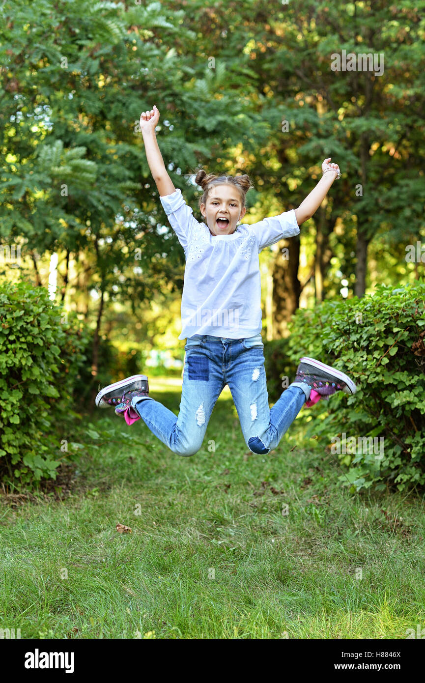 Little girl jumps Stock Photo - Alamy