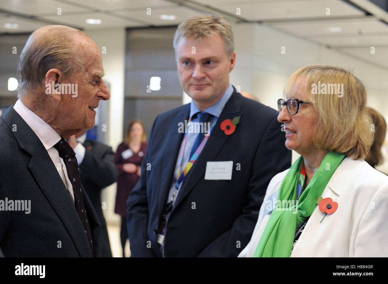 The Duke of Edinburgh (left), talks with staff member Nick Carter and ...