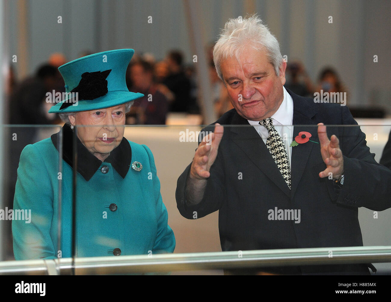 Queen Elizabeth II, stands with Sir Paul Nurse, director of the Francis ...