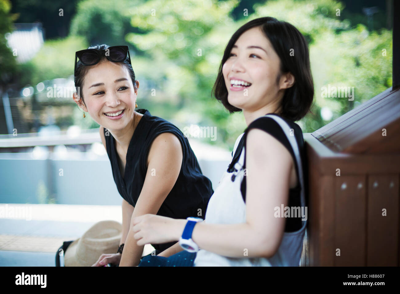 Portrait of two smiling young women Stock Photo - Alamy