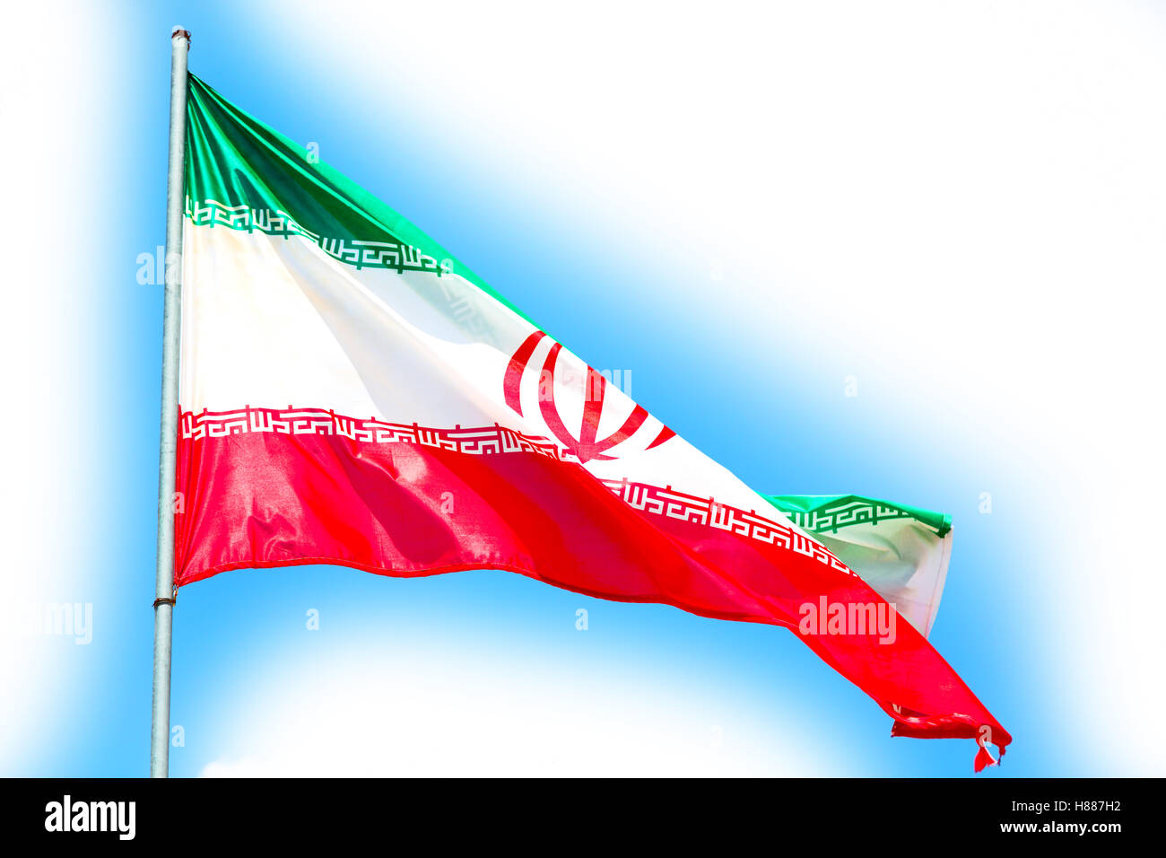in iran blur iranian waving flag the blue sky and wind Stock Photo - Alamy