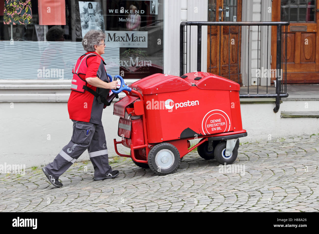 Mail being delivered using an electric powered cart, Stavanger, Norway ...