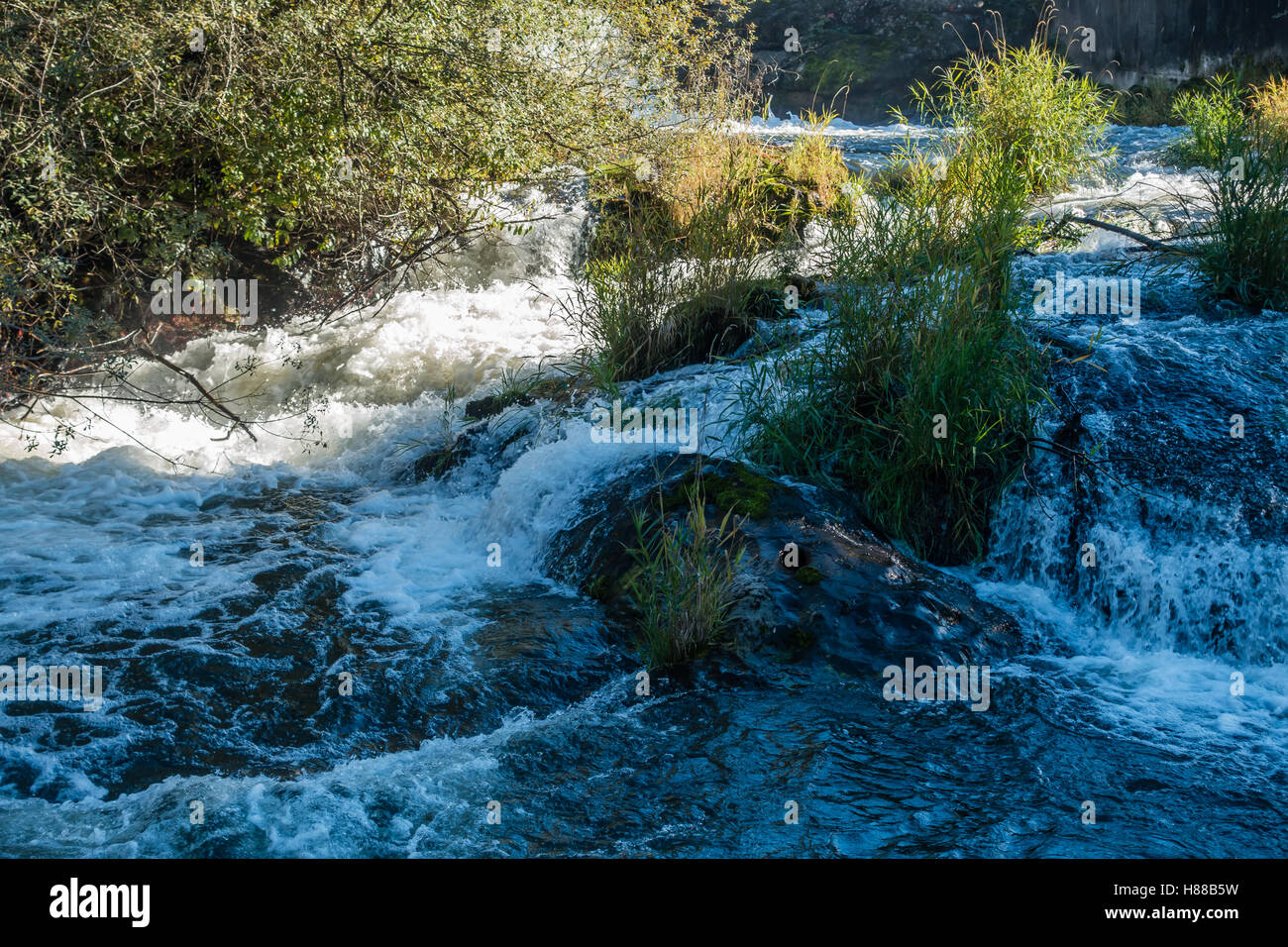 A view of the Deschutes River with whitewater and waterfalls Stock ...