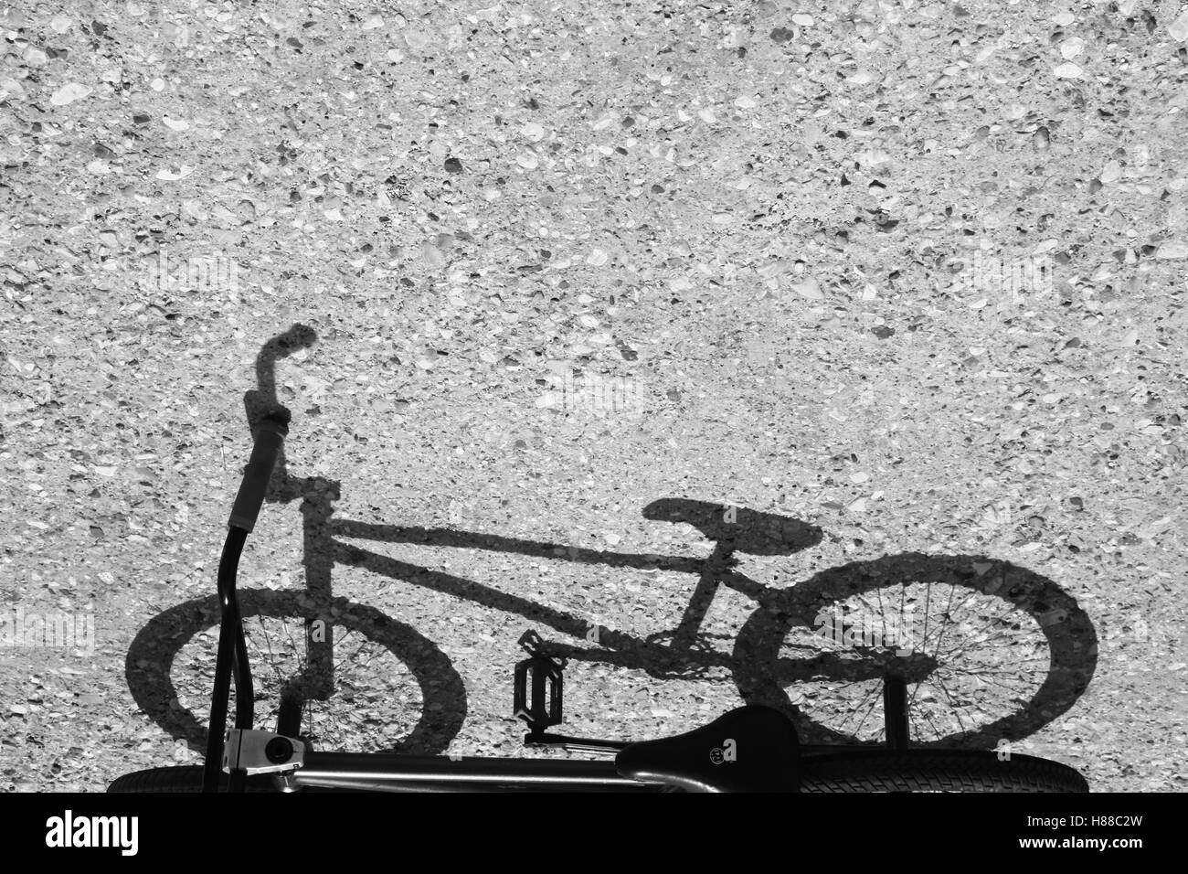 a shadow of a bike is a bike Stock Photo - Alamy