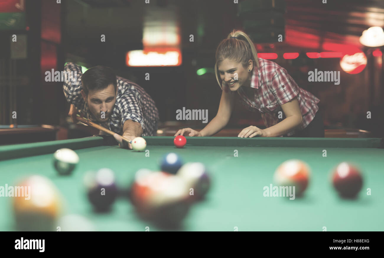 Couple playing snooker together Stock Photo - Alamy