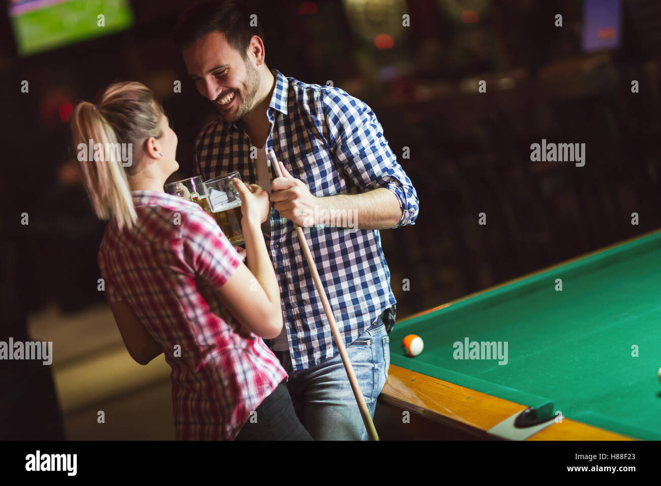 Couple playing snooker together Stock Photo - Alamy