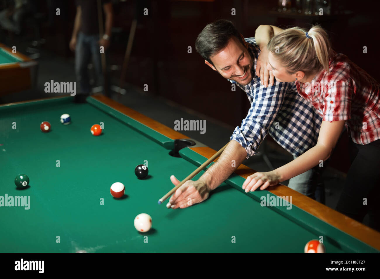 Couple playing snooker together Stock Photo - Alamy