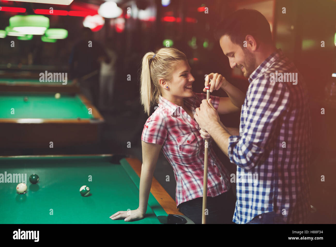 Couple playing snooker together Stock Photo - Alamy