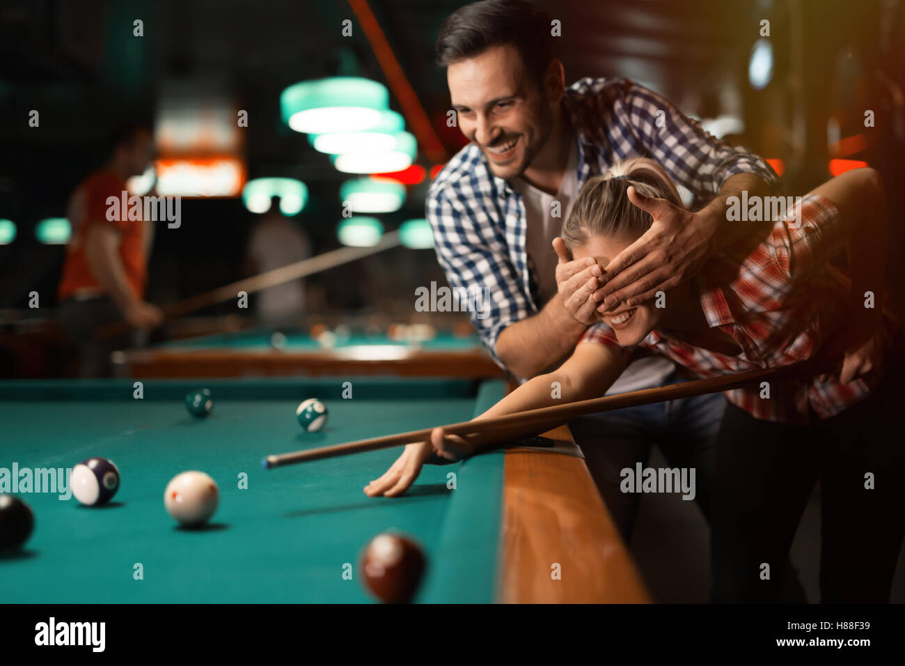 Couple playing snooker together Stock Photo - Alamy