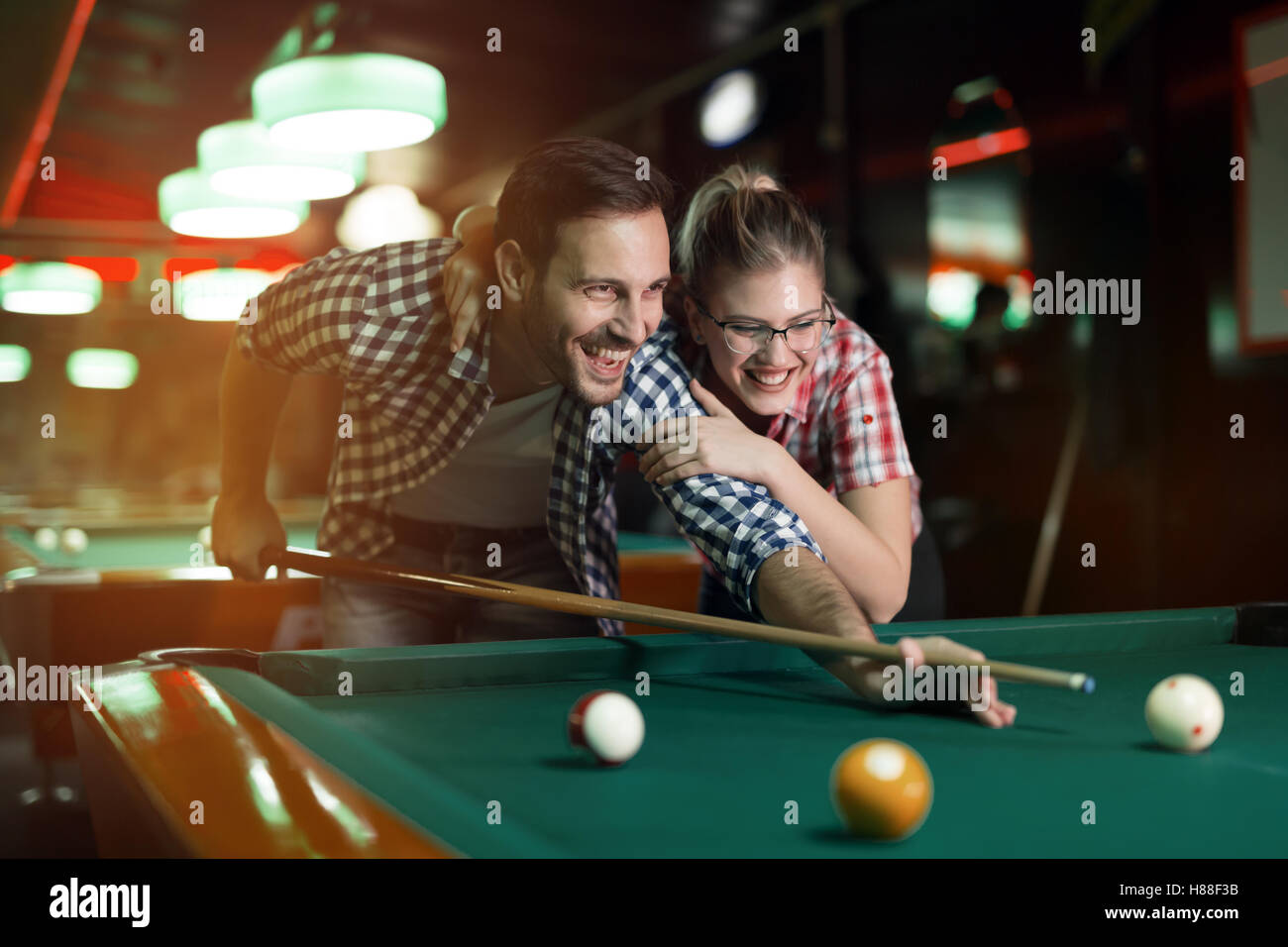 Couple playing snooker together Stock Photo - Alamy