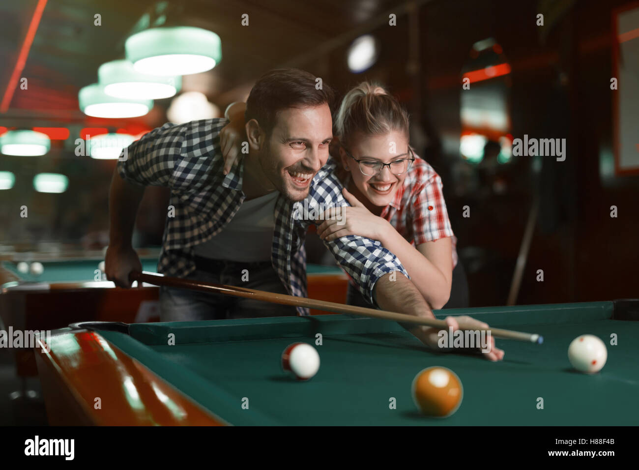 Couple playing snooker together Stock Photo - Alamy