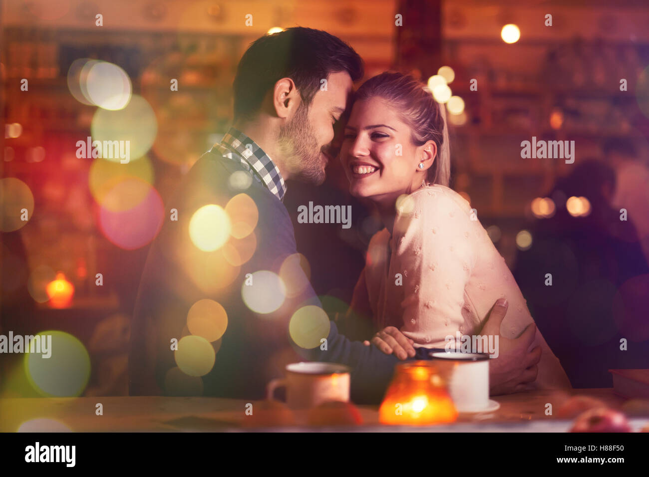 20s couple restaurant night laughing hi-res stock photography and ...