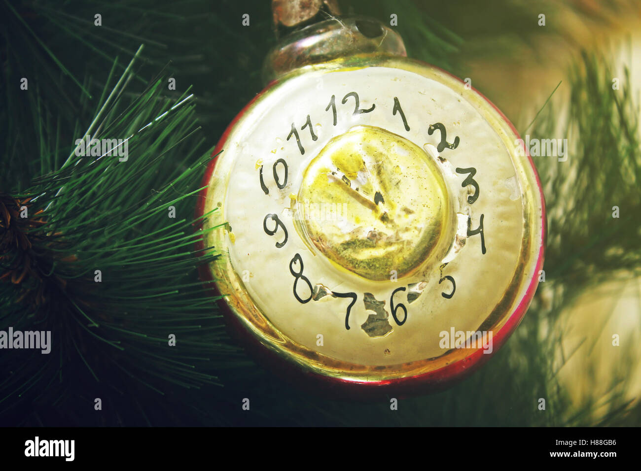 Toy "clock" on the Christmas tree Stock Photo - Alamy