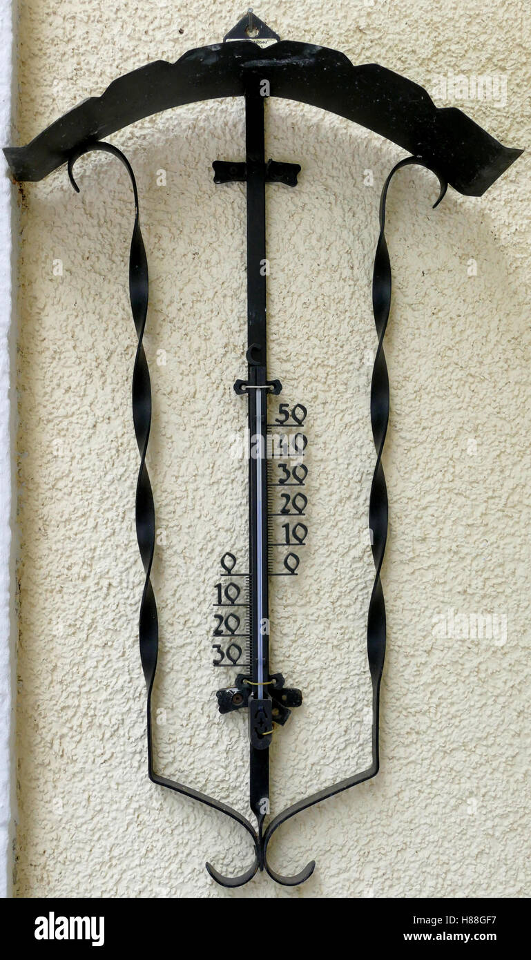 Old decorative thermometer on the wall Stock Photo - Alamy