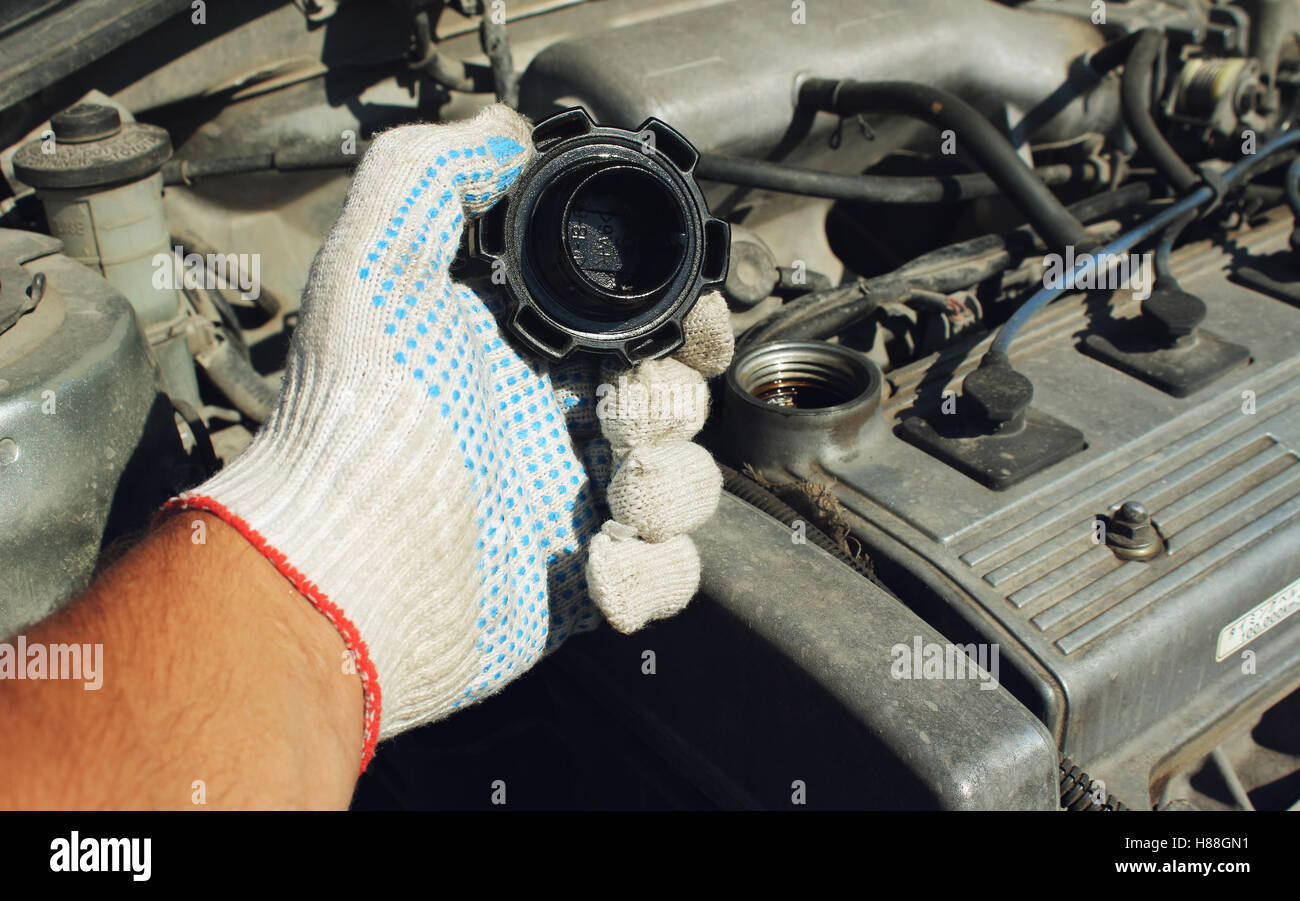 The cover oil filler neck of the car in a hand Stock Photo - Alamy