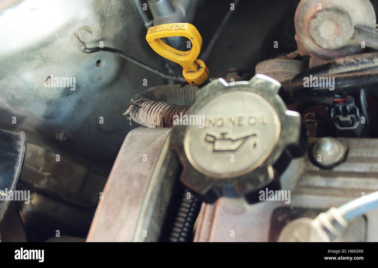 The oil dipstick of a car engine Stock Photo - Alamy