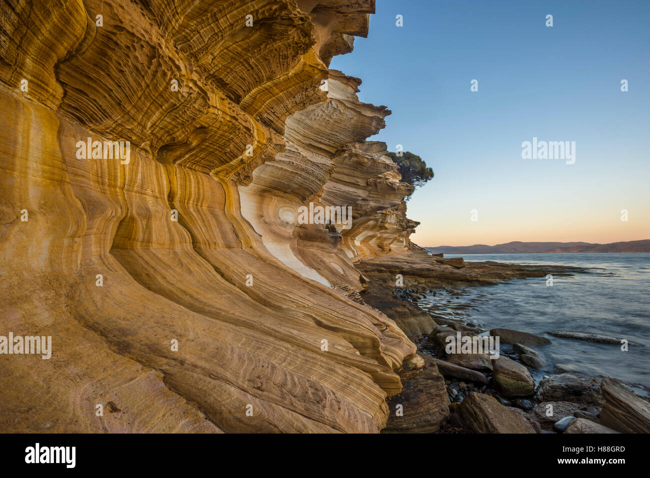 Coastal sandstane cliffs undercut by wave action, Painted Cliffs, Maria ...