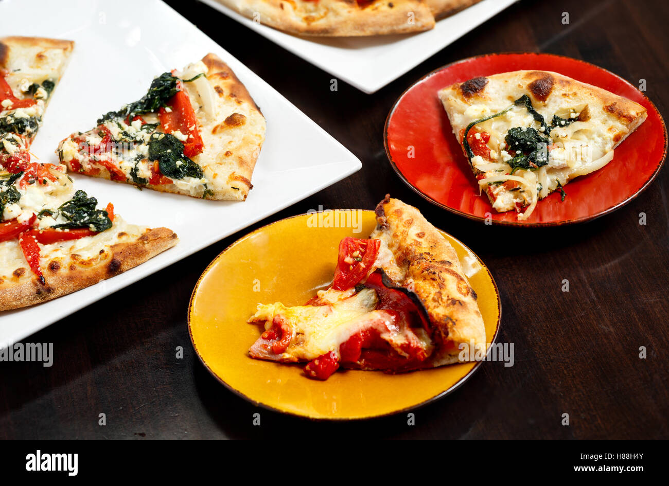 Slices of a Variety of Pizza Flavors Stock Photo - Alamy