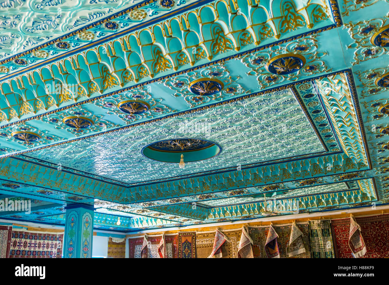 The ceiling of the rug store decorated with fretwork and colorful ...