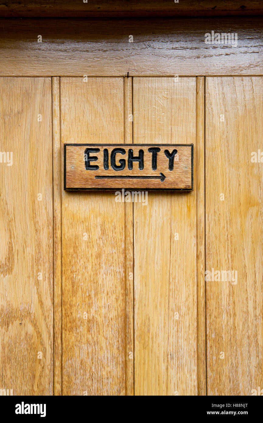 Eighty. Wooden door number sign. Cotswolds. UK Stock Photo - Alamy