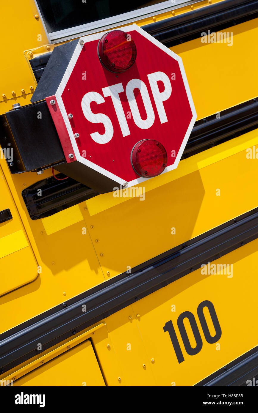 Stop sign on yellow school bus Stock Photo - Alamy