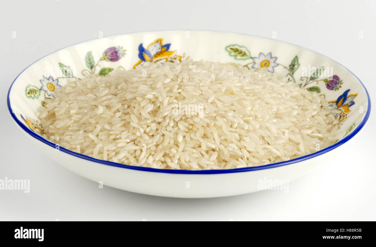 Rice in decorative plate Stock Photo - Alamy