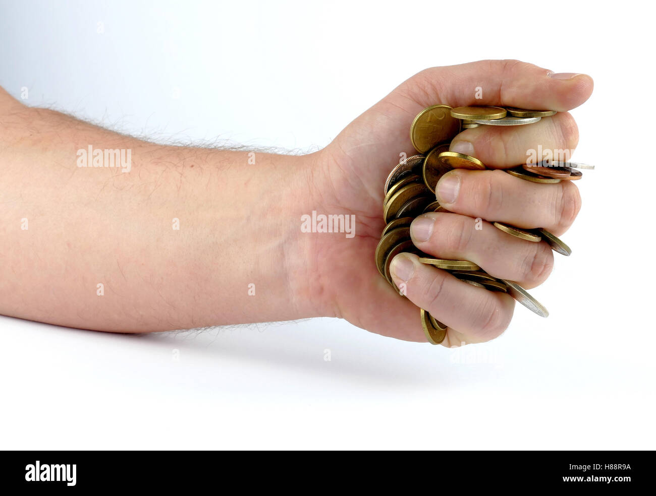 Handful of coins Stock Photo - Alamy