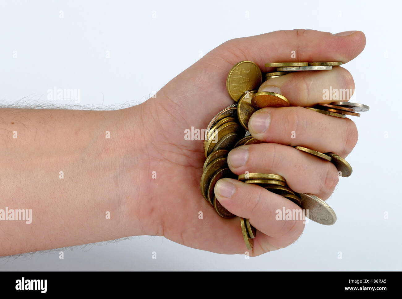 Handful of coins Stock Photo - Alamy
