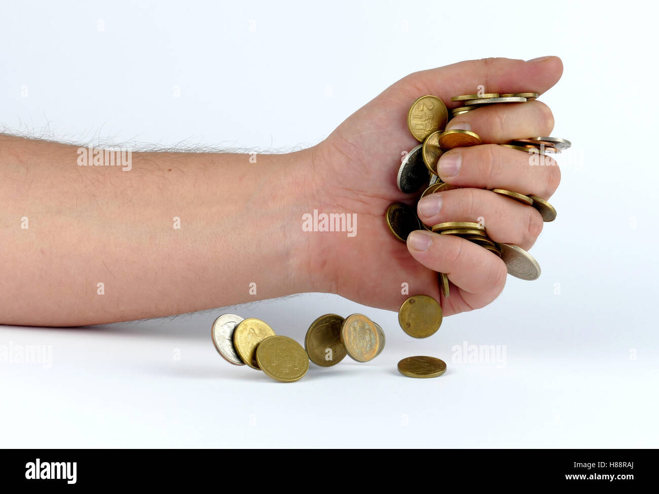 Handful of coins Stock Photo - Alamy