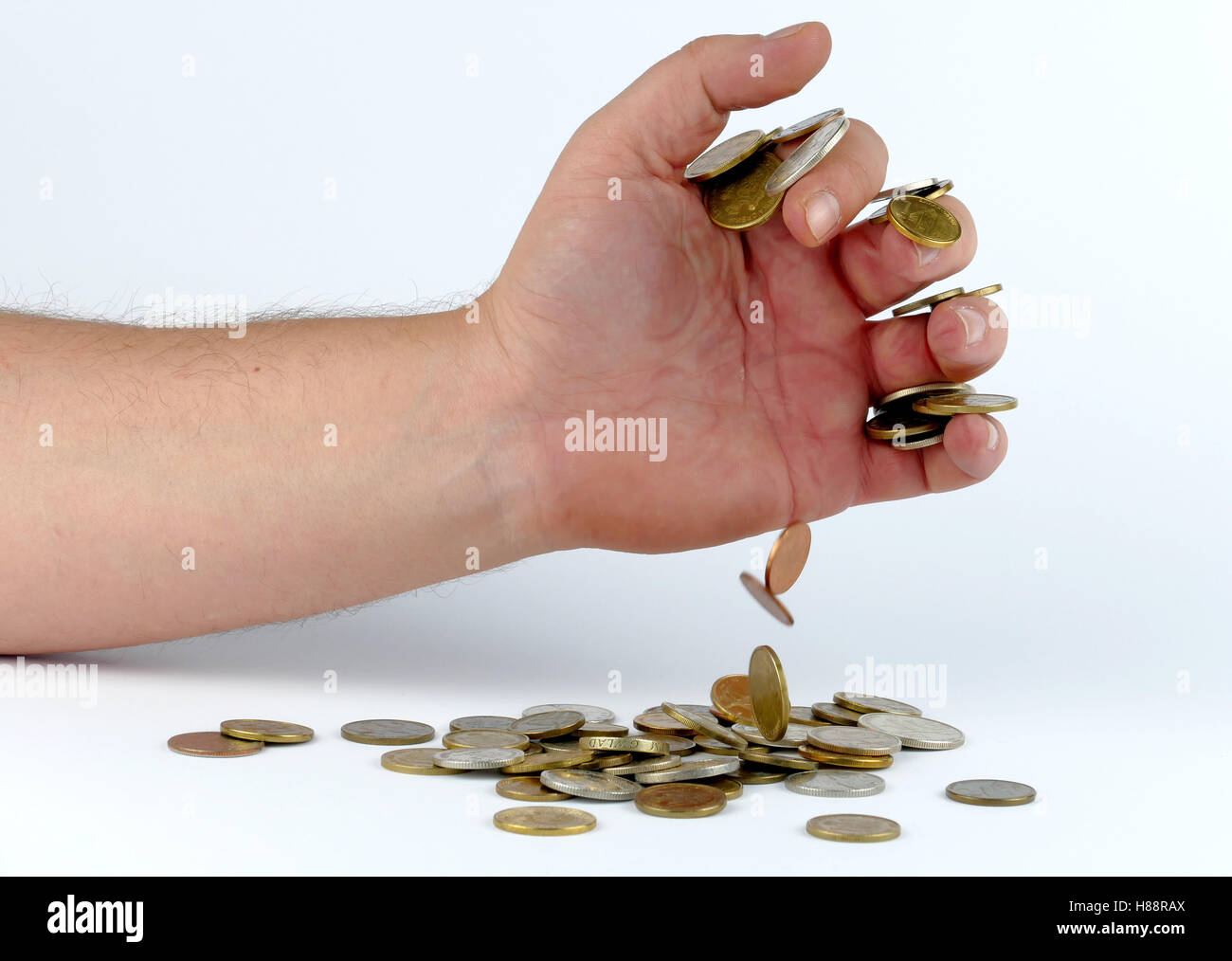 Handful of coins Stock Photo - Alamy