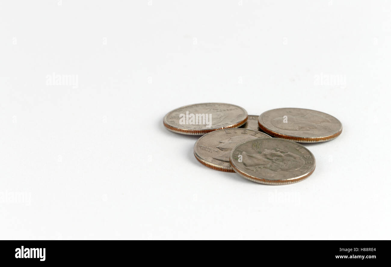 US quarter coins isolated on white background Stock Photo - Alamy