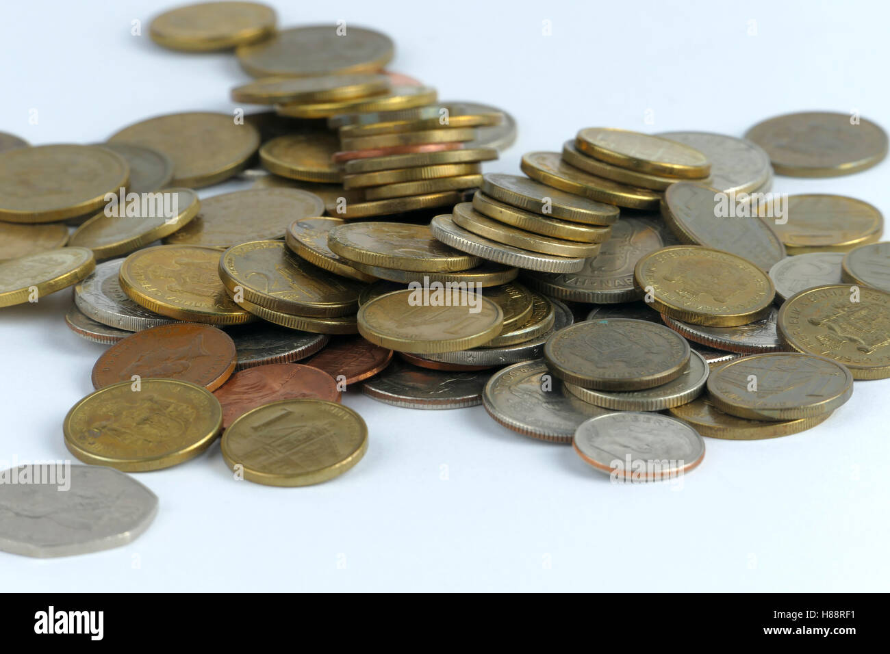 Pile of coin isolated on white background Stock Photo - Alamy