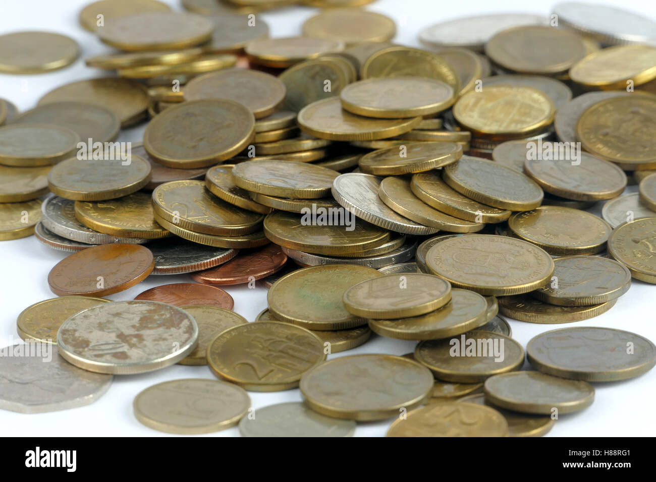 Pile of coin isolated on white background Stock Photo - Alamy