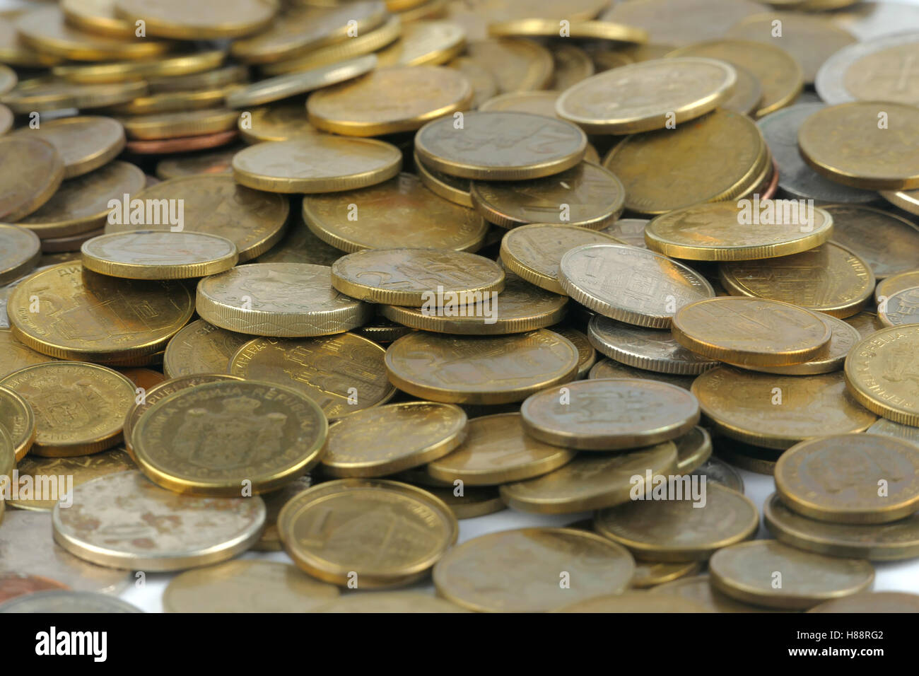 Pile of coin isolated on white background Stock Photo - Alamy