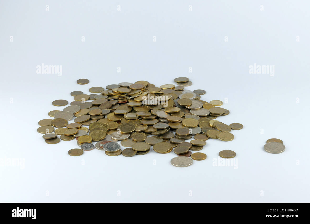 Pile of coin isolated on white background Stock Photo - Alamy