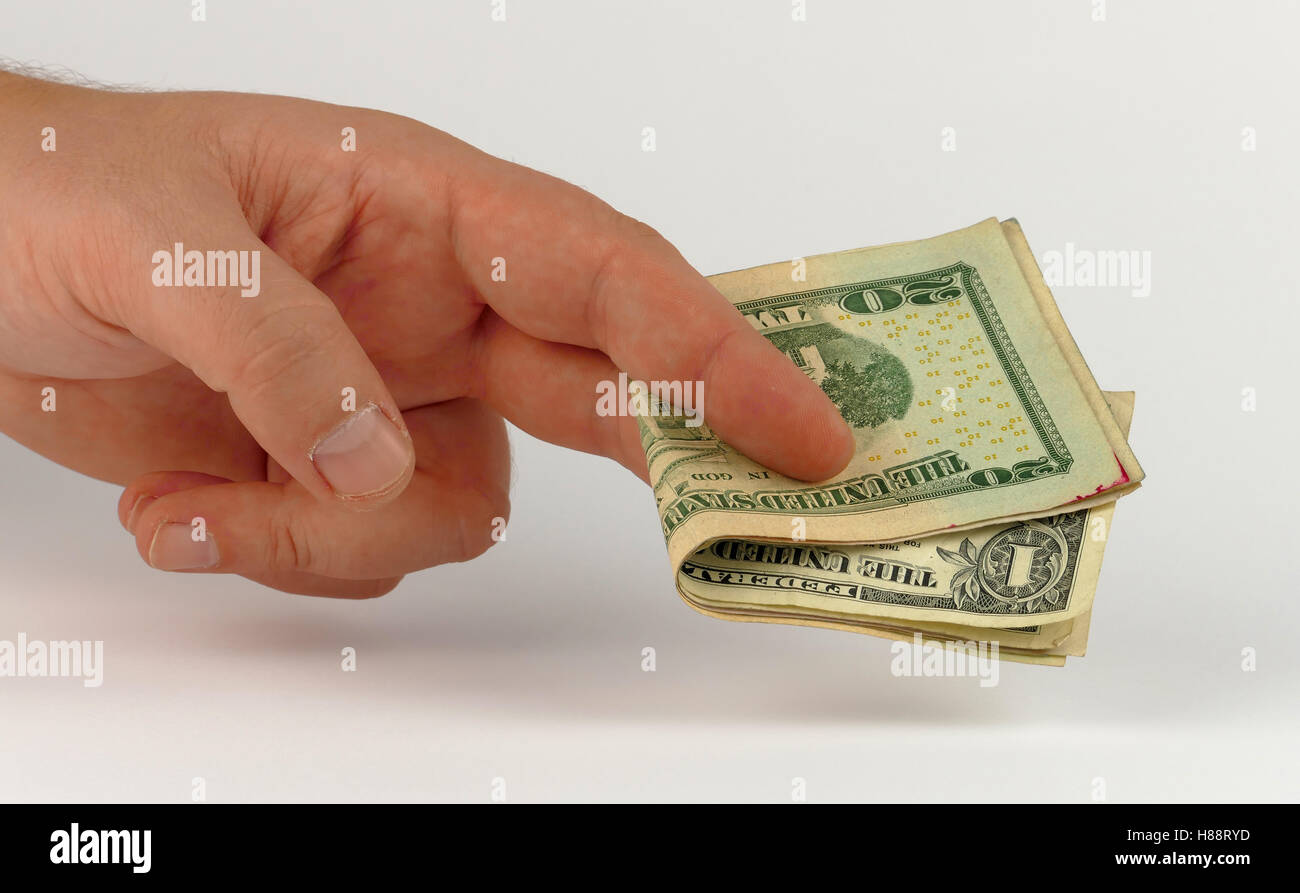 Money in the hand isolated on white background Stock Photo - Alamy