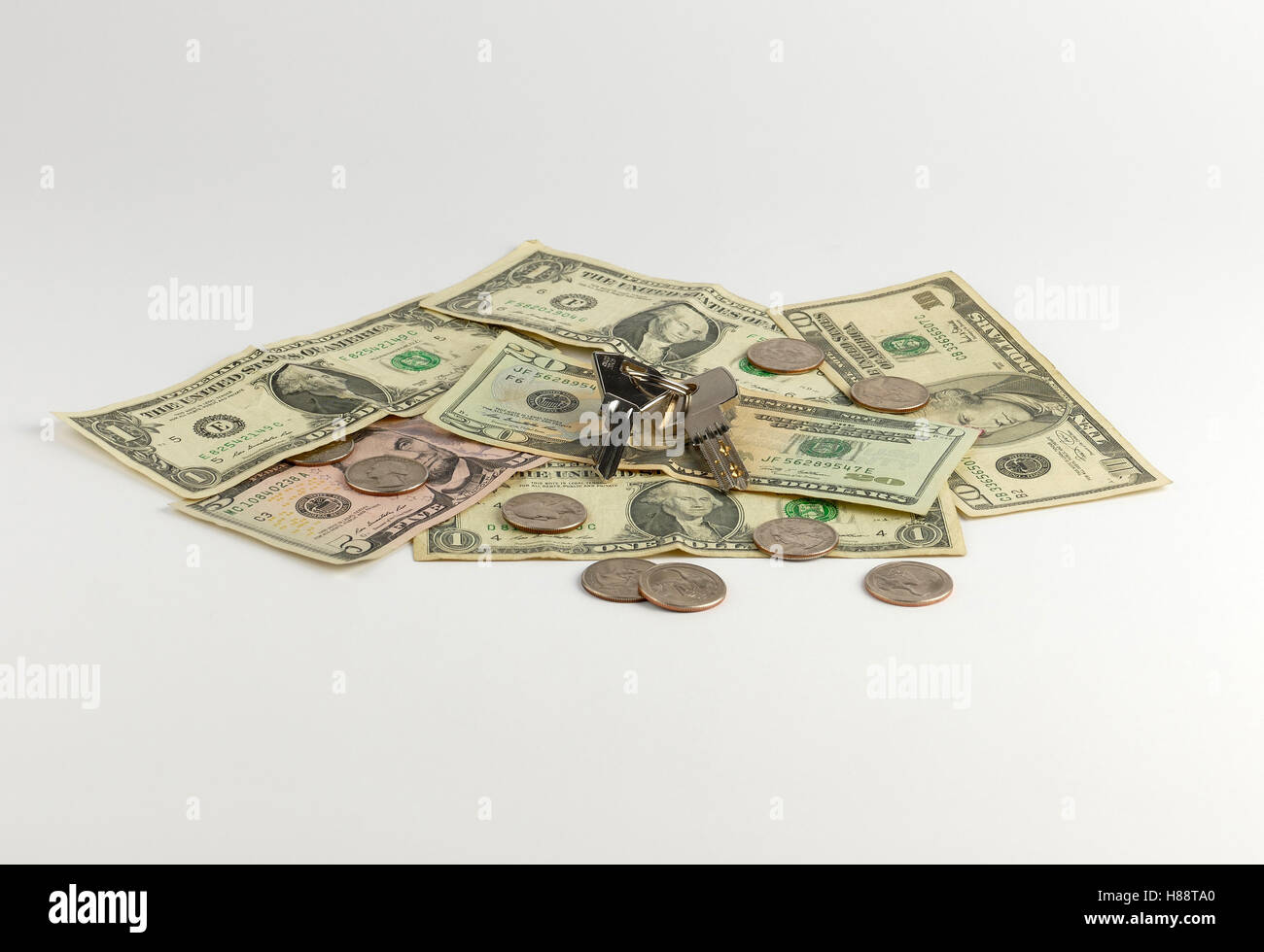 Keys and money isolated Stock Photo - Alamy