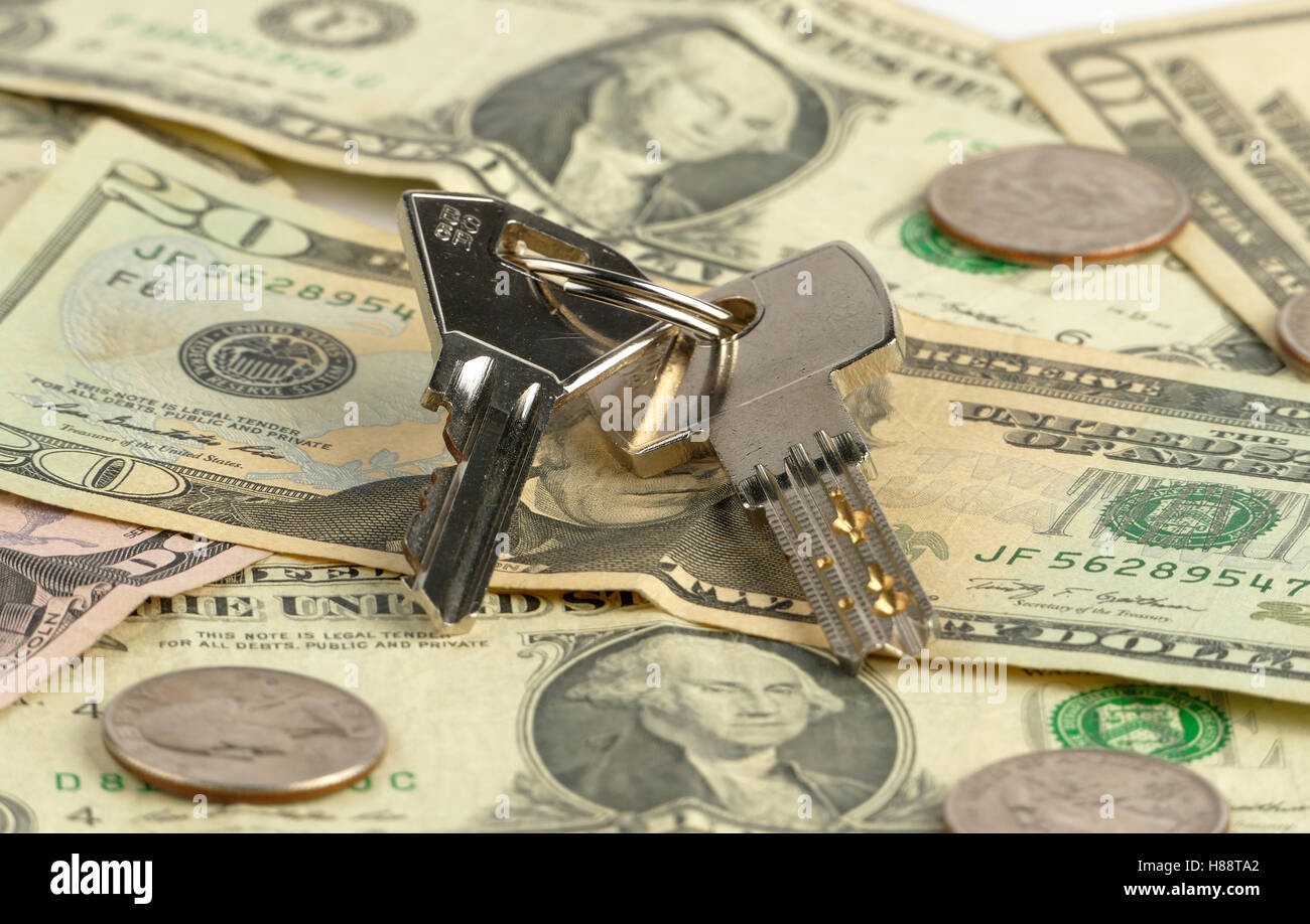 Keys and money isolated Stock Photo - Alamy