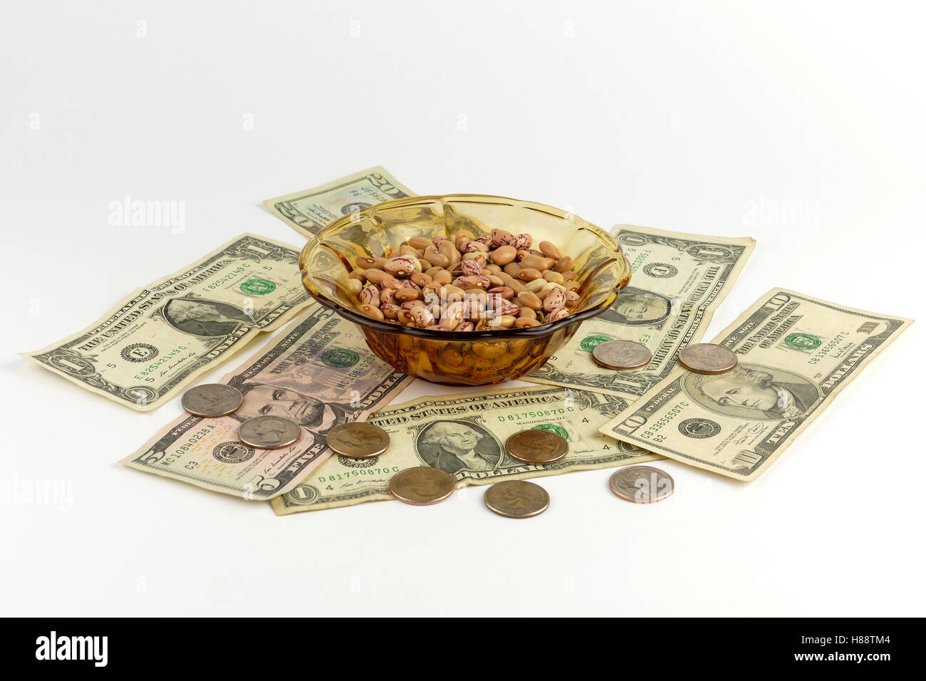 Beans and money isolated on white background Stock Photo - Alamy