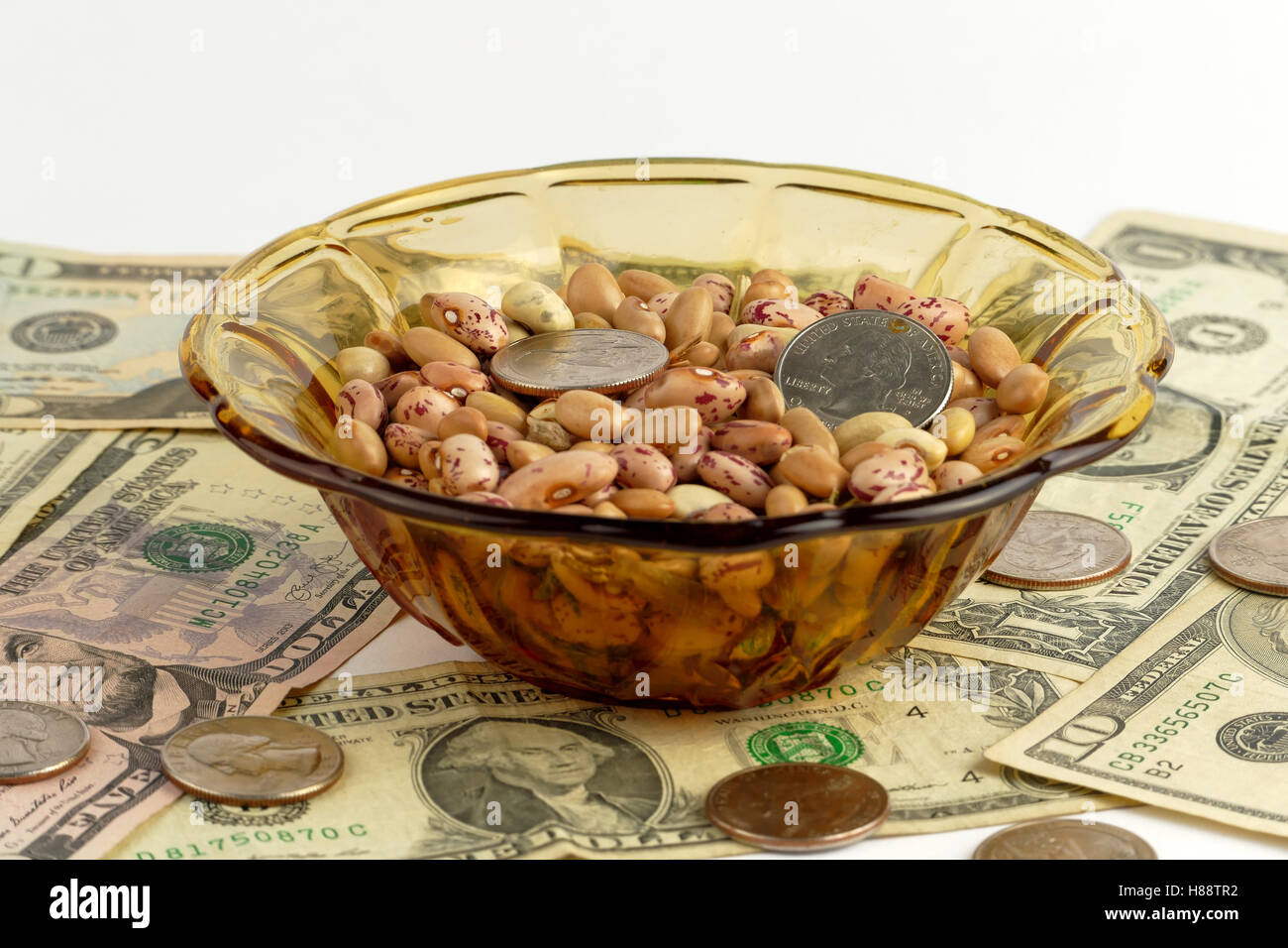 Beans and money isolated on white background Stock Photo - Alamy